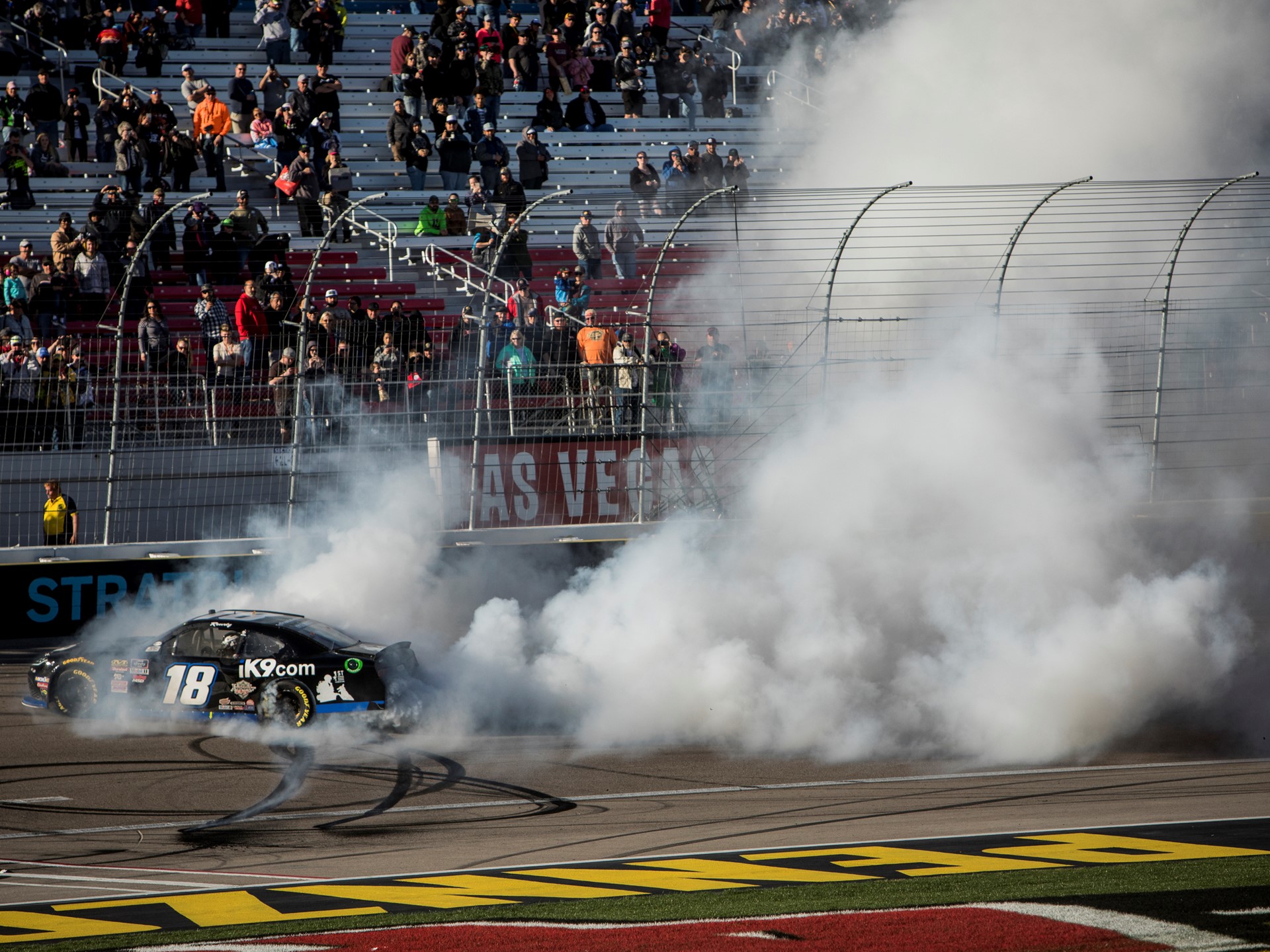 Kyle Busch performs a burnout