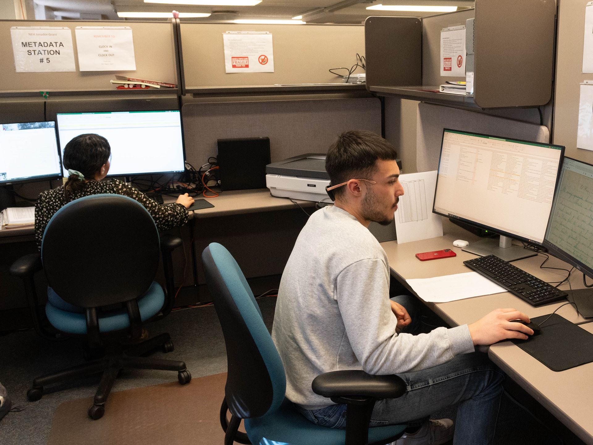Laisha Corona and Oscar Garcia work on the Amador family digitization ...