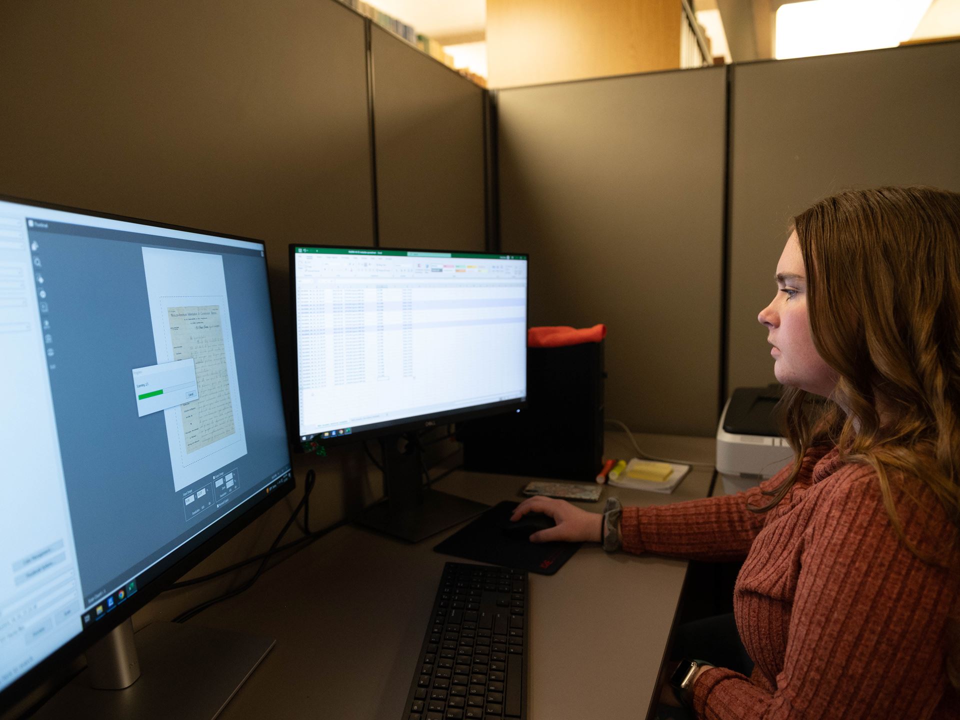 Emily Duke a communications disorder student working on a digitization ...